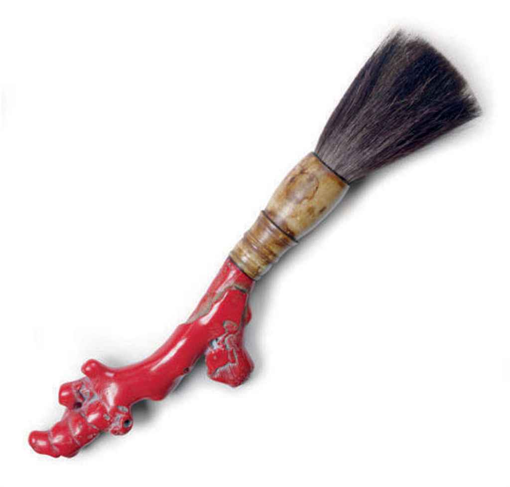 A CHINESE CALLIGRAPHY BRUSH MOUNTED WITH A SIMULATED BONE AND RED CORAL HANDLE 20TH CENTURY a-chinese-calligraphy-brush-mounted-with-a-simulated-bone-and-red-coral-handle-20th-century