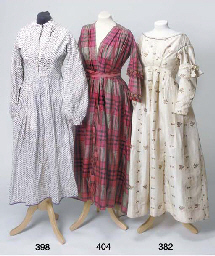 A lady's dress of sprigged muslin, woven with a self-coloured checked ...