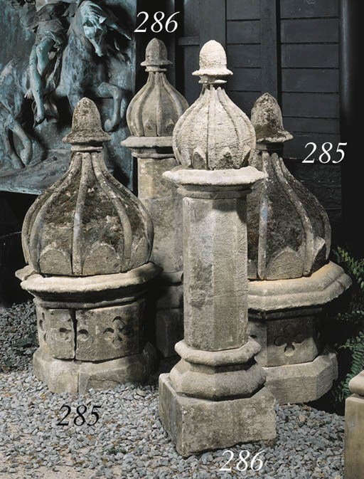 A pair of English stone cupular finials
