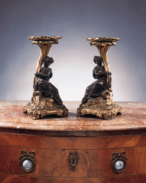 A pair of French bronze and ormolu oil lamp stands, circa 1850