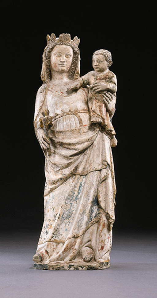 A FRENCH GOTHIC POLYCHROME AND PARCEL-GILT LIMESTONE FIGURE OF THE ...