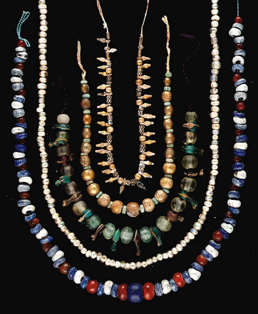 A CARTHAGINIAN GLASS HEAD PENDANT , CIRCA 5TH-4TH CENTURY B.C. | Christie's