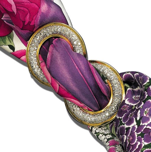 A DIAMOND AND BICOLORED GOLD SCARF SLIDE | Christie's