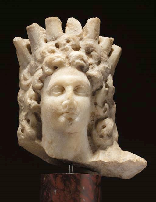 A LATE HELLENISTIC MARBLE HEAD OF ALEXANDER HELIOS , 1ST CENTURY B.C./A ...