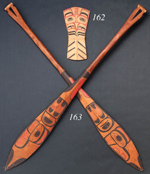 A PAIR OF NORTHWEST COAST POLYCHROME WOOD CEREMONIAL PADDLES