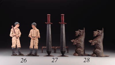 A PAIR OF CAST IRON BASEBALL PLAYER ANDIRONS , STAMPED "R.B.S./09 ...