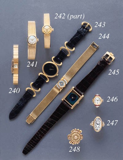 Swiss. A 14K gold and gem-set ring watch , DIAL SIGNED RATTERMANN ...