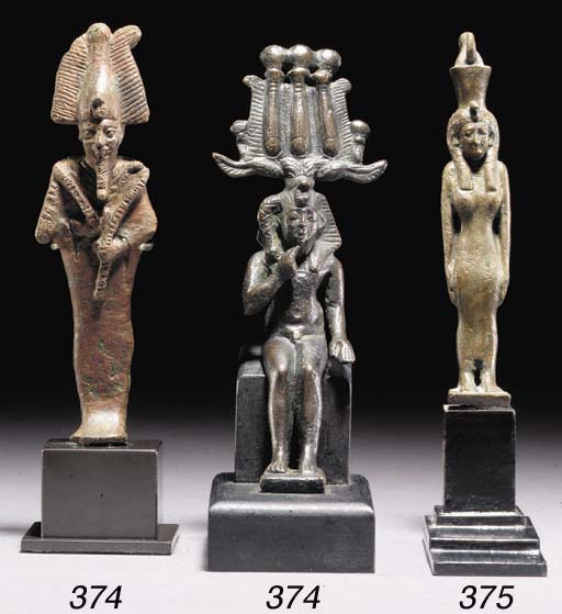 AN EGYPTIAN BRONZE FIGURE OF THE GODDESS MUT