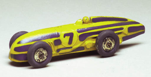 A pre-war Dinky yellow and blue 'Humbug' pattern 23a Racing Car