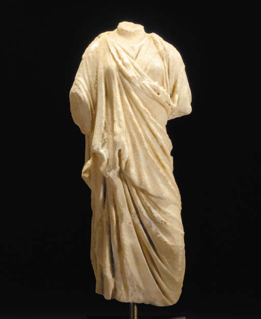 A LATE HELLENISTIC MARBLE DRAPED FEMALE TORSO