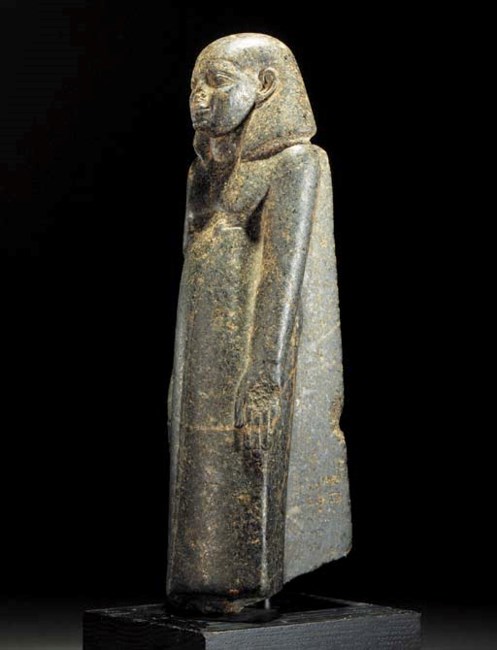 AN EGYPTIAN DIORITE STATUE OF AN OFFICIAL , MIDDLE KINGDOM, LATE ...