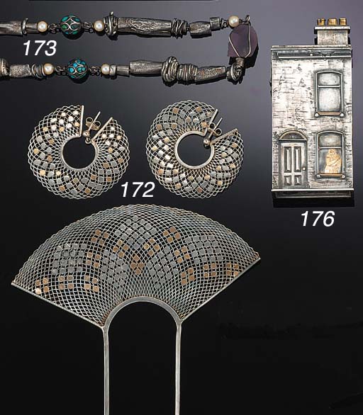 A Wally Gilbert hair slide and matching earrings
