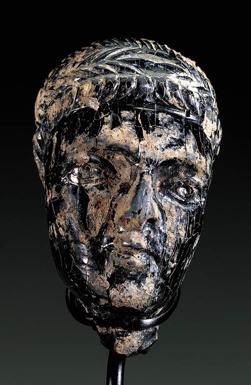 A LATE ROMAN JET HEAD OF A MAN