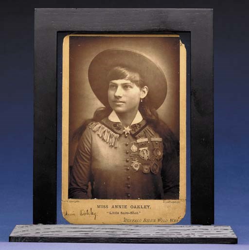 OAKLEY, Annie (1860-1926). Cabinet photograph signed ("Annie Oakley ...