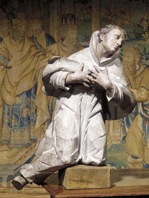 A polychrome carved figure of a Dominican monk
