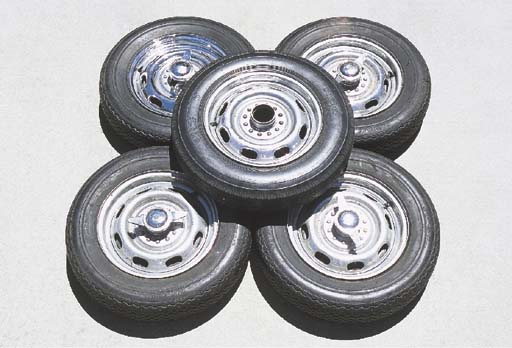 A set of five used Rudge knock-off wheels with tyres, complete with ...