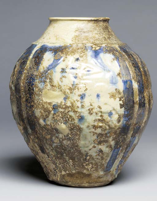 A RAQQA MOULDED POTTERY VASE