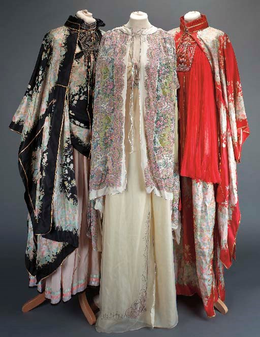 An exotic robe of red silk, printed with roses and poppies, overlaid ...