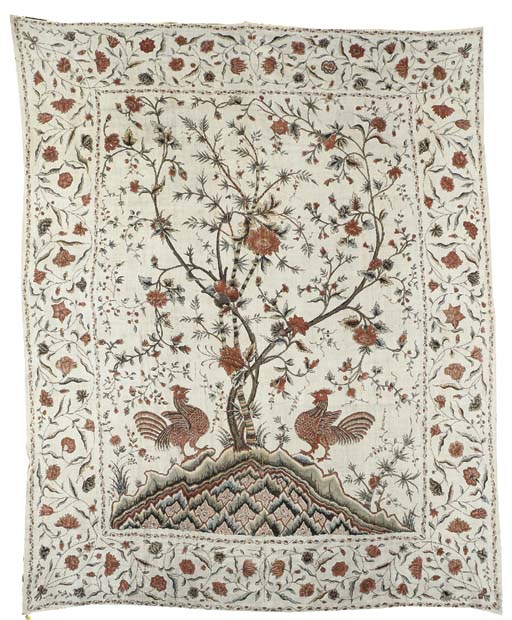 A palampore, printed and painted with a tree of life on a rocky mound ...