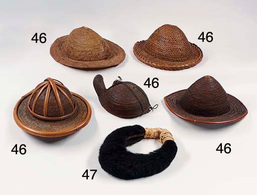 A collection of wicker and split cane hats, including a scull cap with ...