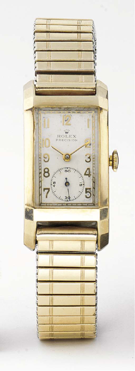 ROLEX, A RARE 9ct. GOLD RECTANGULAR CURVED WRISTWATCH Signed Rolex ...