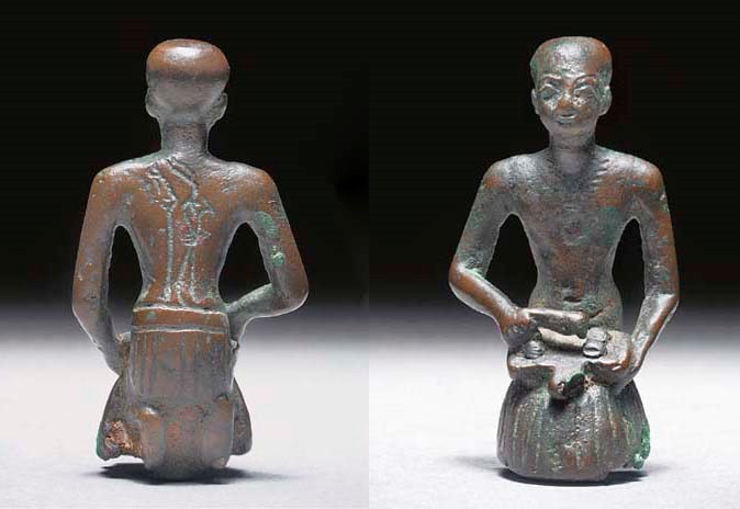 AN EGYPTIAN BRONZE FIGURE OF A KNEELING LIBATION PRIEST , THIRD ...