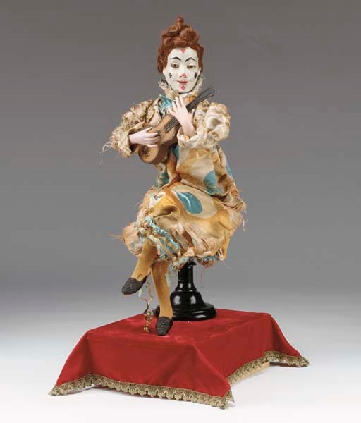 A Lambert clown guitar player automaton | Christie's