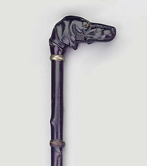 A carved ebony and gnarled hardwood walking stick, LATE 19TH CENTURY ...