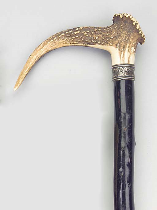 A Victorian antler mounted ebonised gnarled wood walking stick