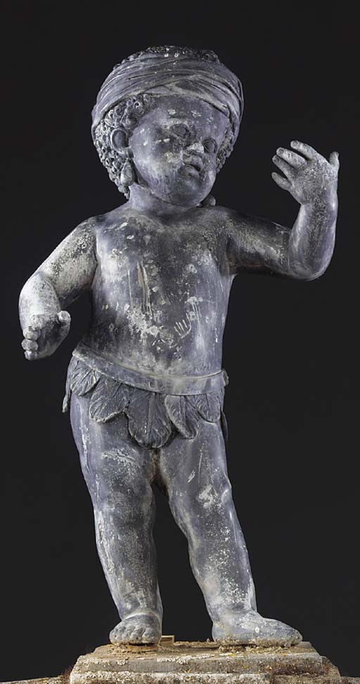 An English lead figure of a cherub personifying Africa