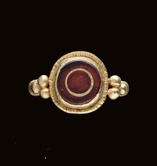 A MEROVINGIAN GOLD AND GARNET FINGER RING , CIRCA 7TH CENTURY A.D ...