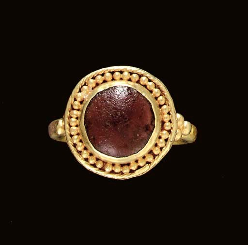 A MEROVINGIAN GOLD AND GLASS FINGER RING , CIRCA 7TH CENTURY A.D ...