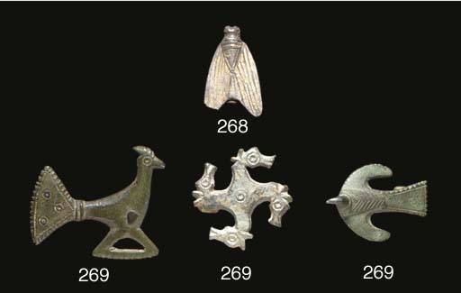 A SOUTH RUSSIAN SILVER FIBULA IN THE FORM OF A CICADA