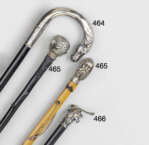 A silvered metal mounted ebonised gnarled cane