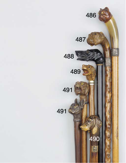 A carved gnarled wood cane