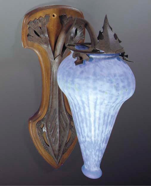 A PATINATED METAL AND GLASS WALL APPLIQUE , DESIGNED BY LOUIS MAJORELLE ...