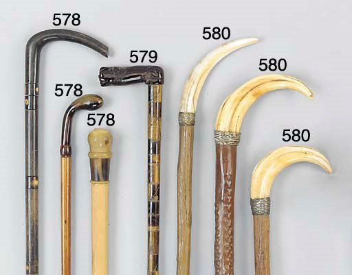 A Continental boar's tusk mounted gnarled wood walking stick, LATE 19TH ...