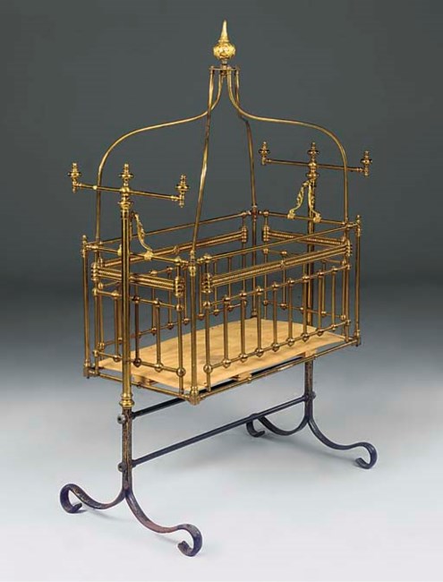 A VICTORIAN GILT BRASS COT | Christie's