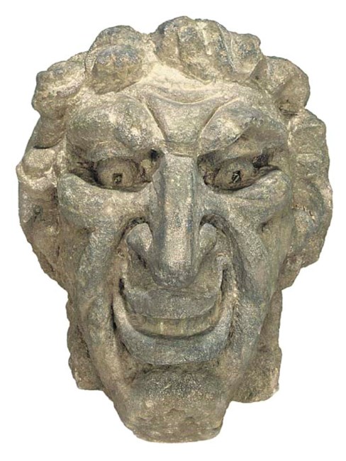 A carved limestone gargoyle head , 19TH CENTURY | Christie's