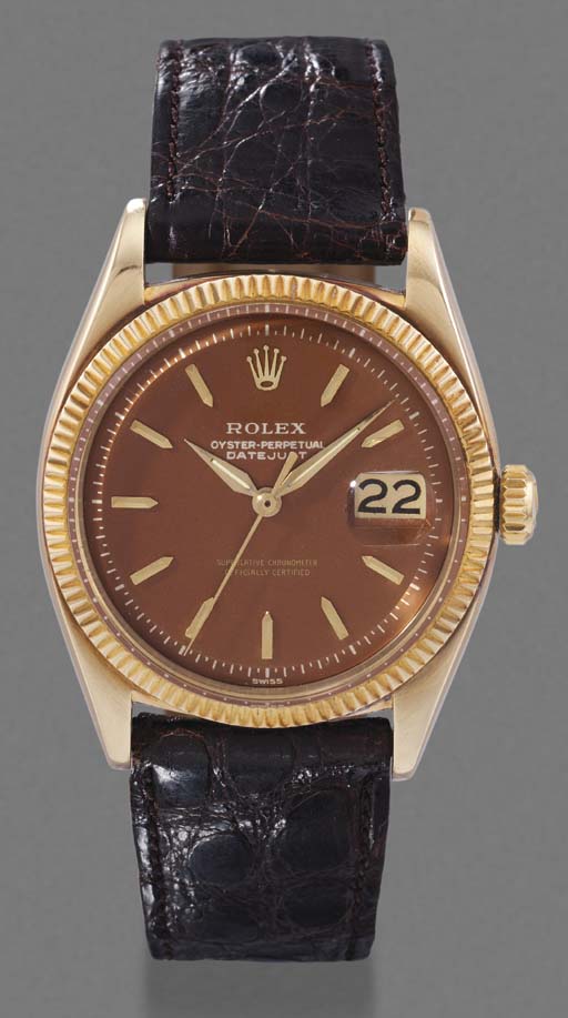 Rolex. An 18K gold ring watch with concealed dial , SIGNED ROLEX ...