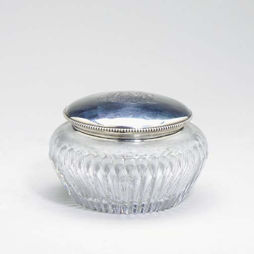 A CUT-GLASS POWDER BOX WITH SILVER COVER,