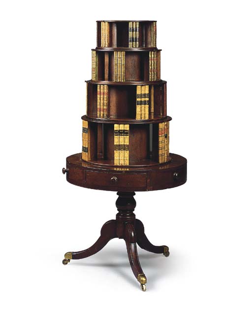 A REGENCY MAHOGANY FOUR-TIER REVOLVING BOOKCASE-ON-STAND