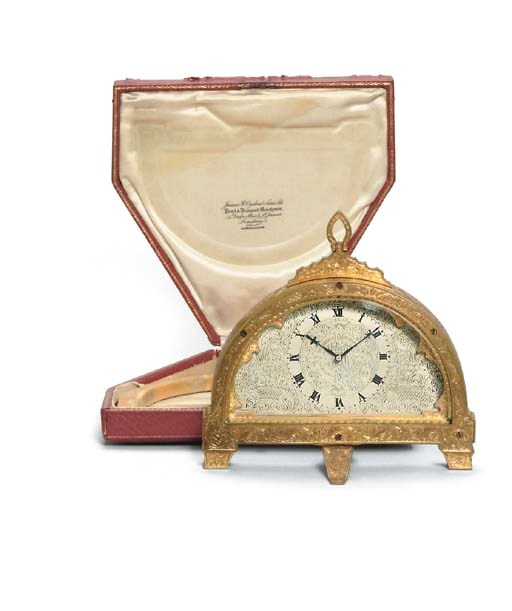 A Victorian engraved gilt-brass desk clock in the manner of Thomas Cole ...