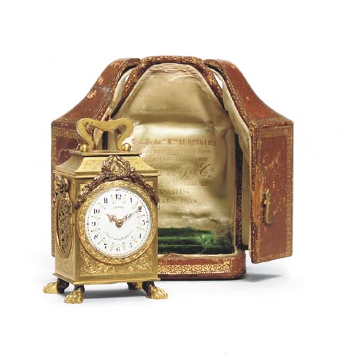 A Victorian engraved gilt-brass desk clock in the manner of Thomas Cole ...
