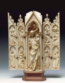 A CARVED IVORY POLYPTYCH CENTRED BY A GROUP OF THE VIRGIN AND CHILD