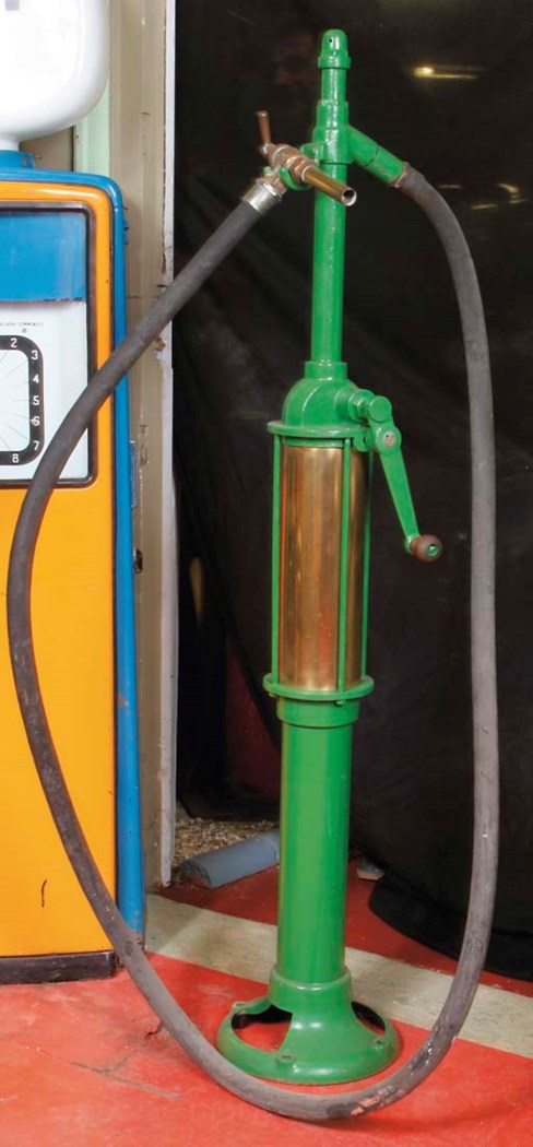 An early pre-war hand-cranked "skeleton" pattern petrol-pump; restored ...