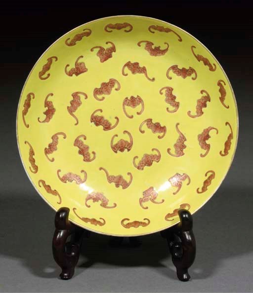 A Chinese yellow ground bat dish, Tongzhi mark and of the period ...