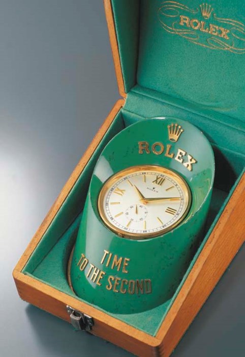 ROLEX. AN UNUSUAL PRESENTATION DESK CLOCK WITH BATTERY OPERATED WINDING
