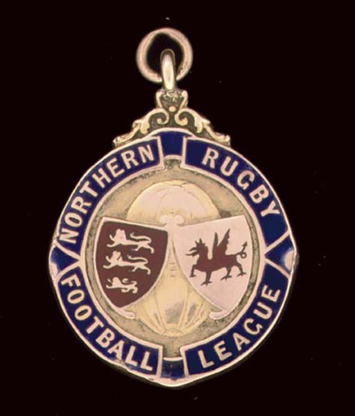 A 15CT GOLD AND ENAMEL NORTHERN RUGBY LEAGUE CHAMPIONSHIP WINNERS MEDAL ...