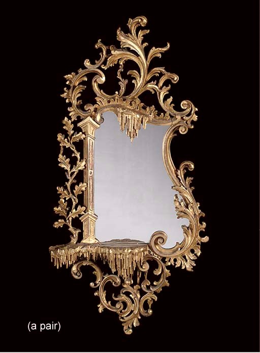 A PAIR OF CARVED GILTWOOD MIRRORS , IN THE ROCOCO STYLE, LATE 19TH ...